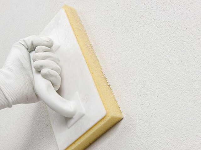 Over-working of painted or wallpapered interior plasters with lime ...